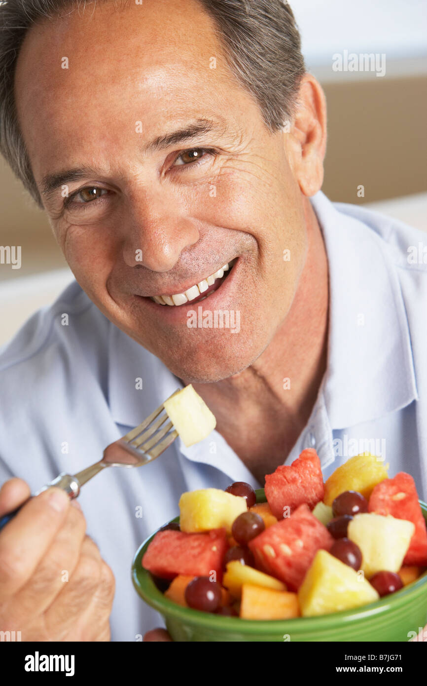 Middle Aged Man Eating Fresh Fruit Salad Stock Photo - Alamy