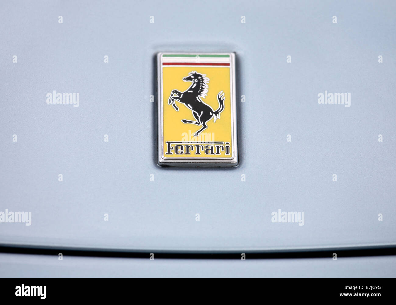 Ferrari bonnet badge on Silver grey car Stock Photo - Alamy