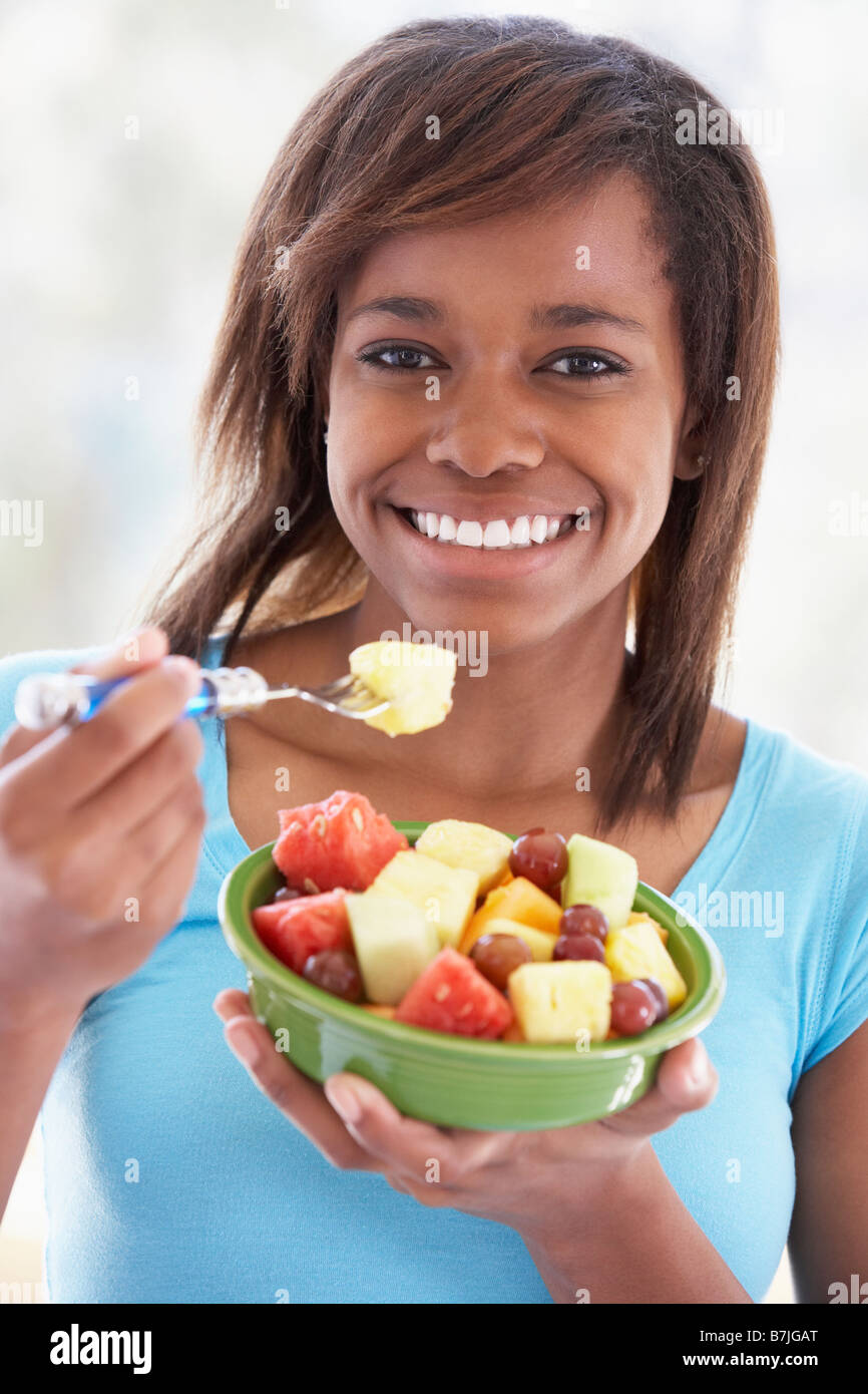 Teenage Girl Eating Fresh Fruit Salad Stock Photo - Alamy