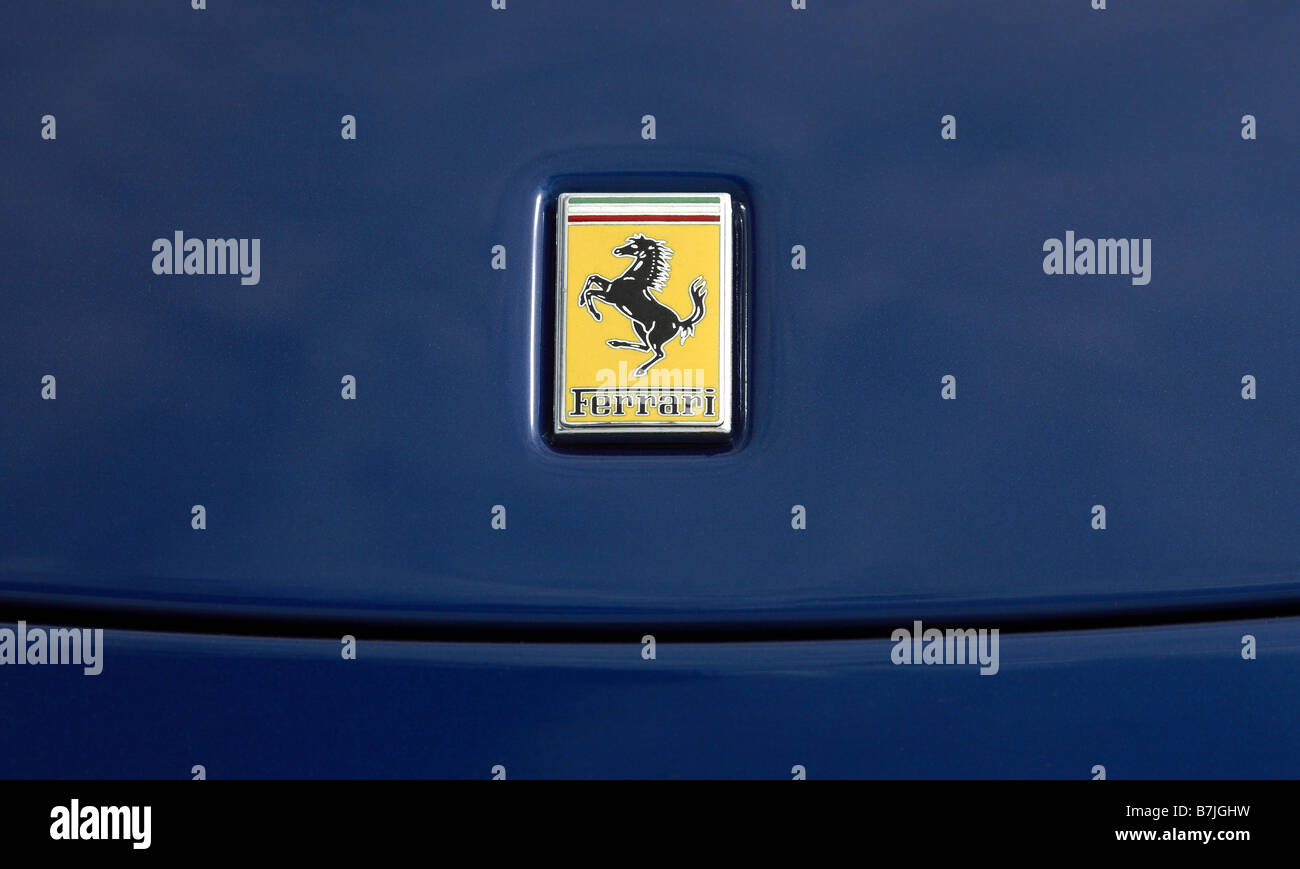 Ferrari bonnet badge on blue car Stock Photo - Alamy