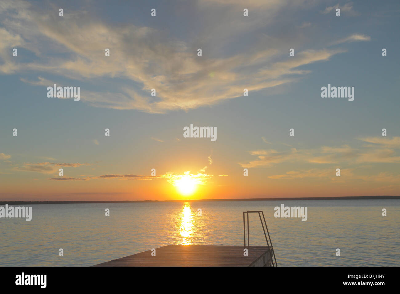 Clear Lake at sunset; Canada, Manitoba, Riding Mountain National Park ...