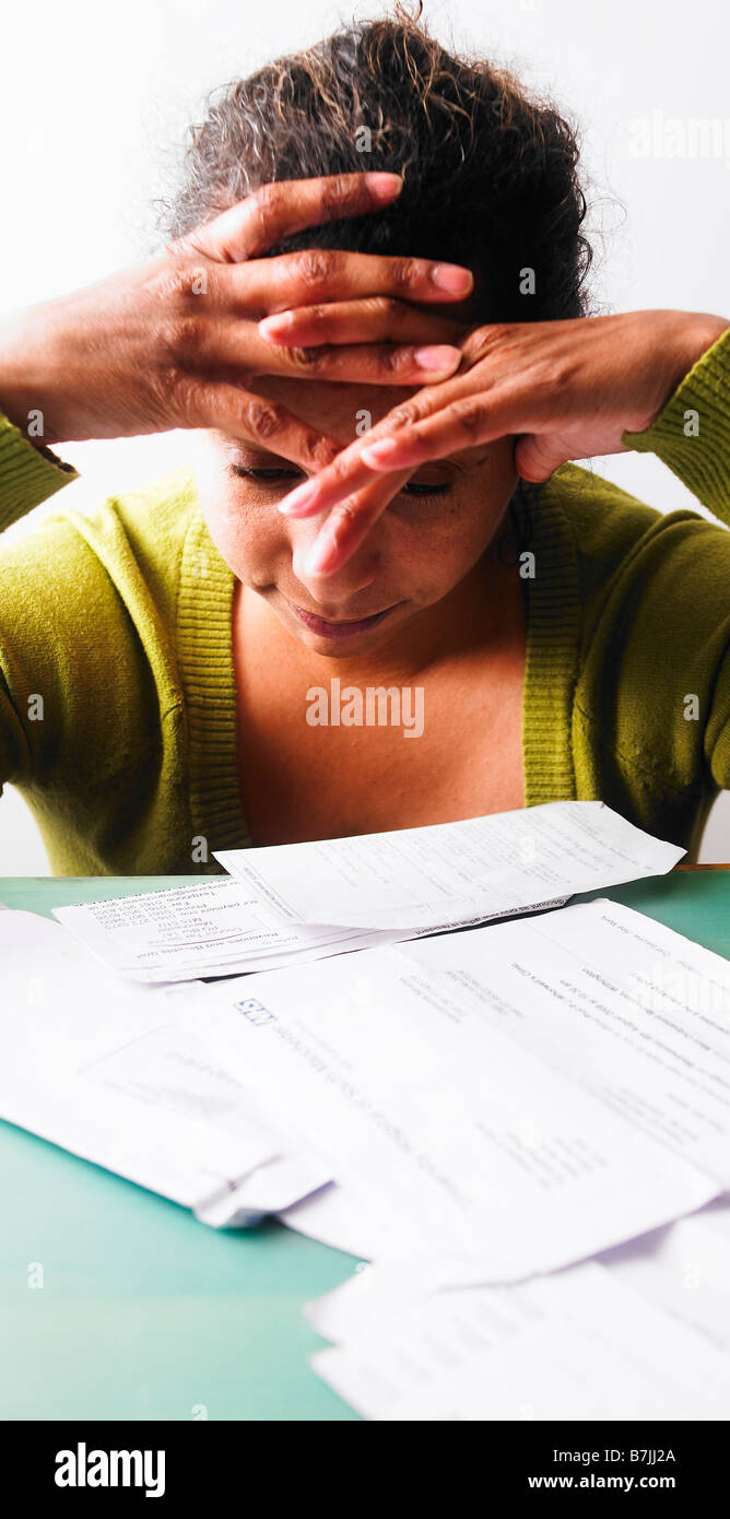 Female, mid thirties, reading bill, suffering from depression,money ...