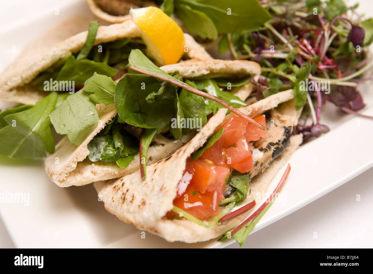 Pitta bread filled with a tuna salad Stock Photo - Alamy