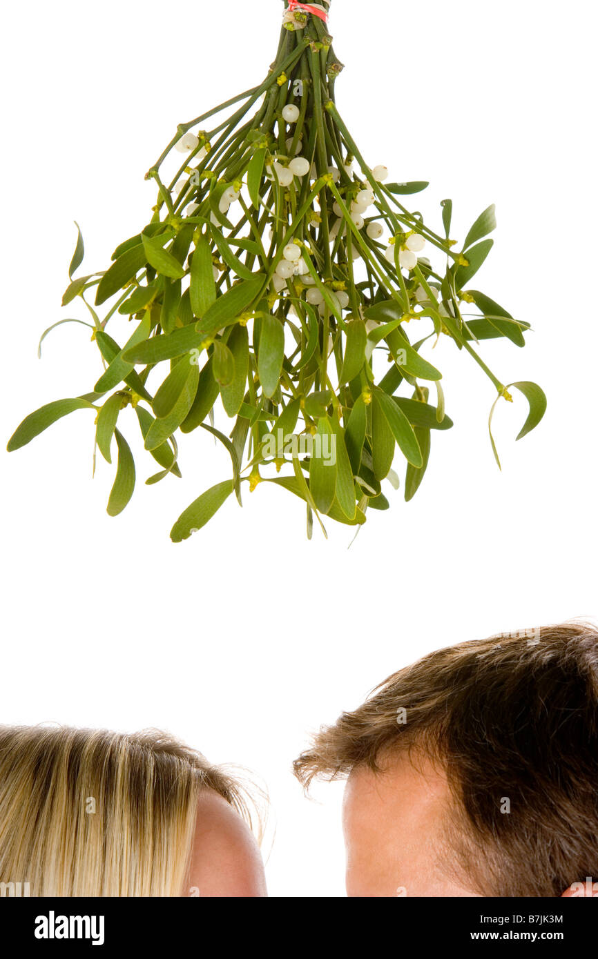 Couple under the mistletoe hi-res stock photography and images - Alamy