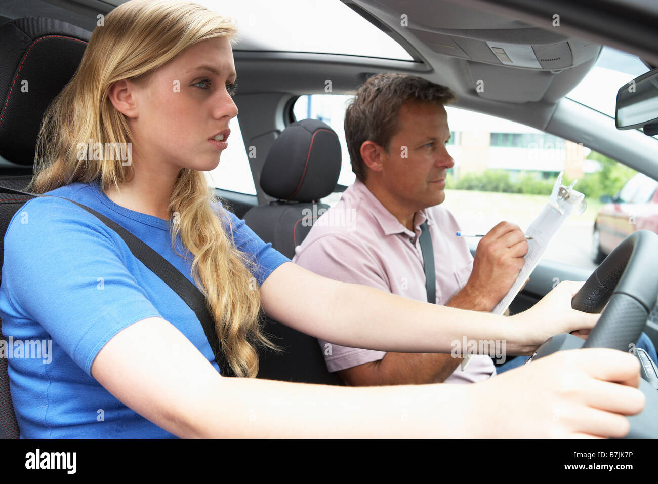 Teenage Girl Taking A Driving Lesson Stock Photo - Alamy