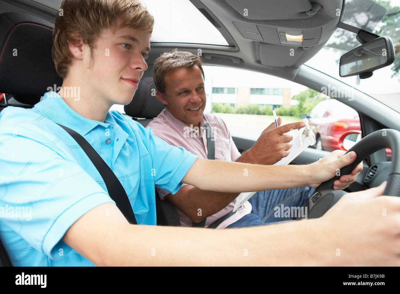 Teenage Boy Taking A Driving Lesson Stock Photo - Alamy