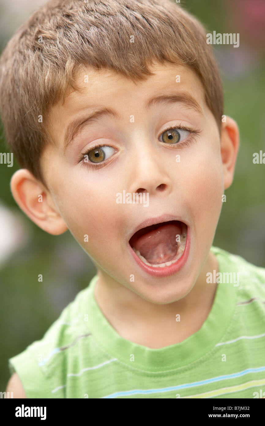 Portrait Of Young Boy Looking Surprised Stock Photo - Alamy