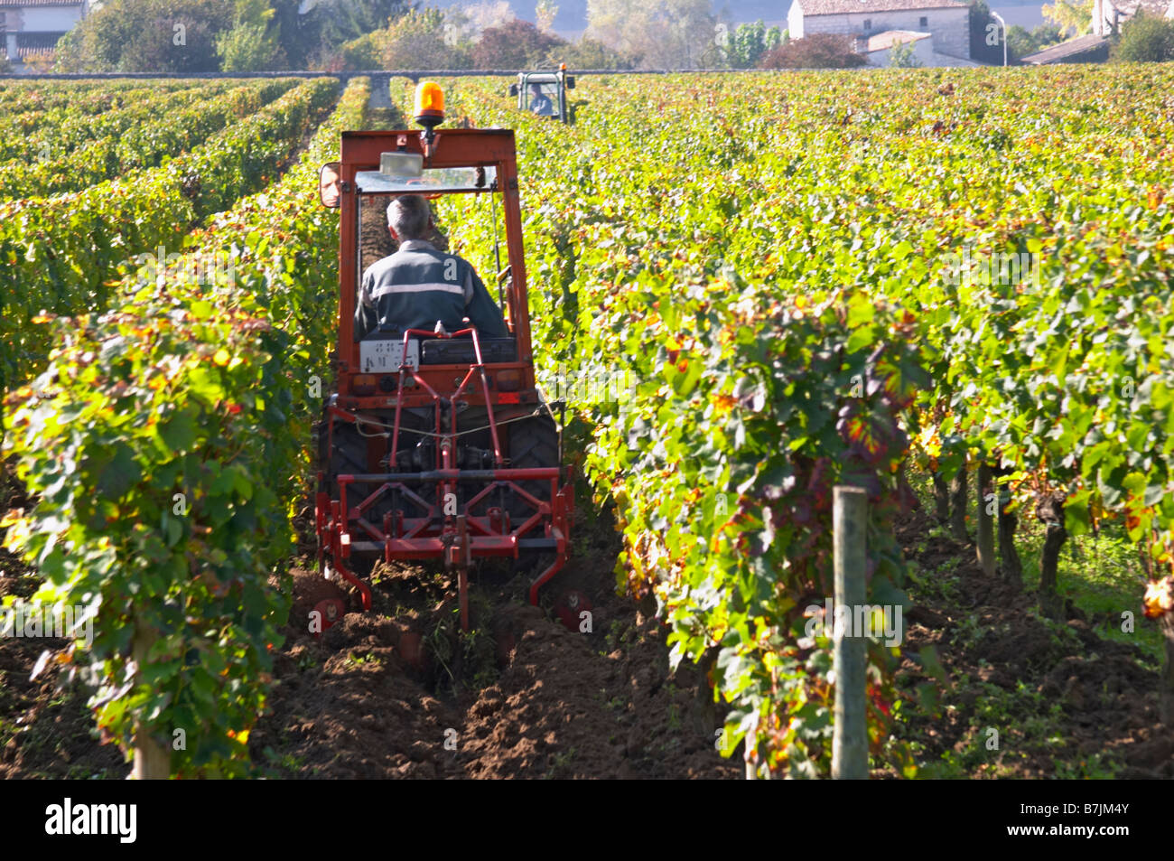 Tractor ploughing soil hi-res stock photography and images - Alamy