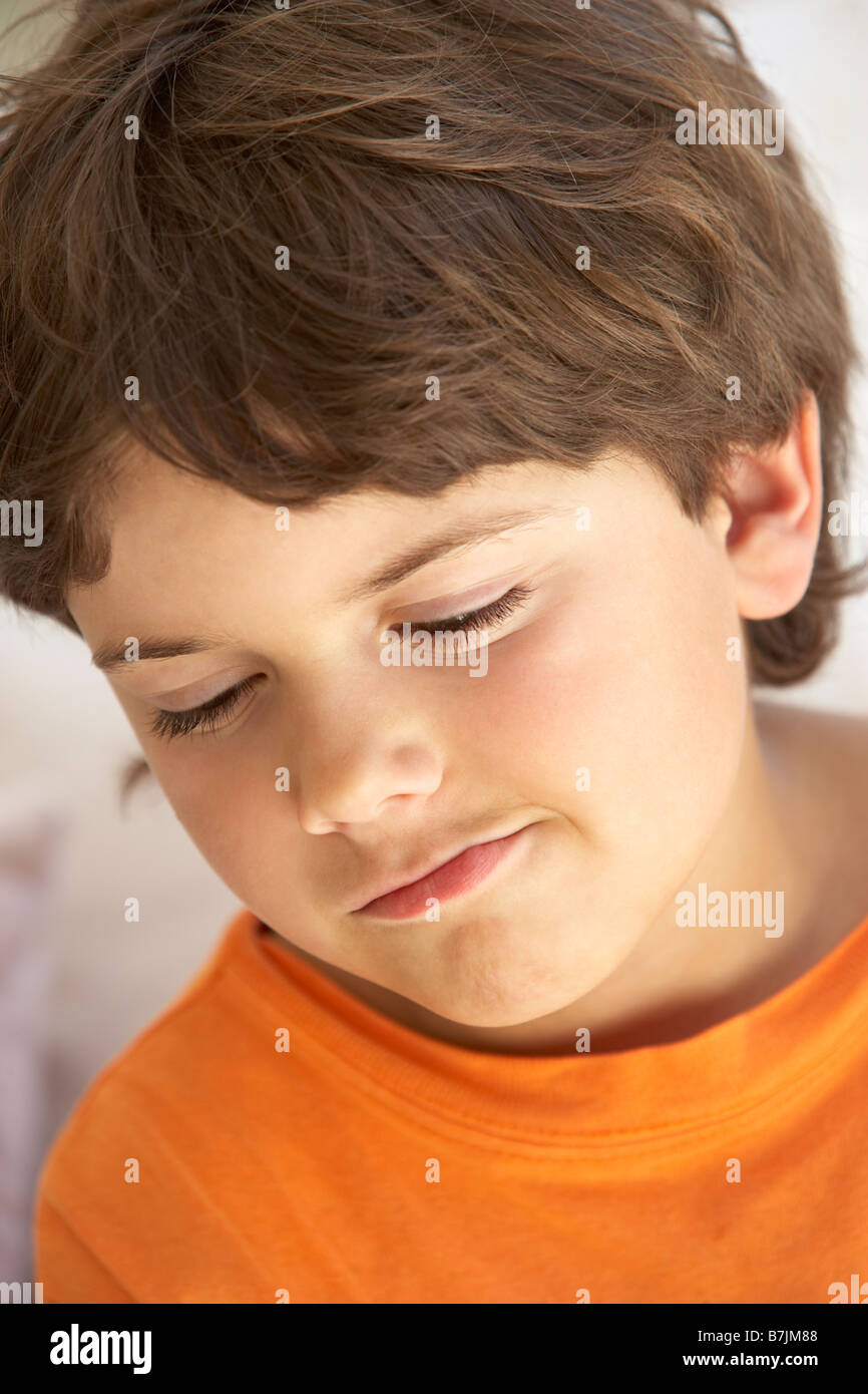 Portrait Of Young Boy Sulking Stock Photo - Alamy