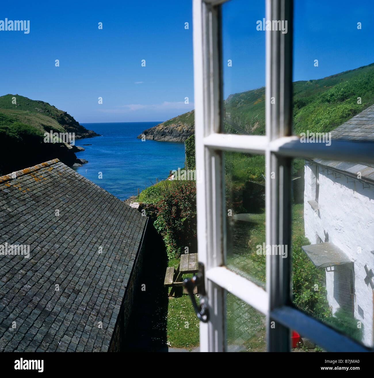 View of Port Quin from a holiday cottage window Cornwall UK Stock Photo ...