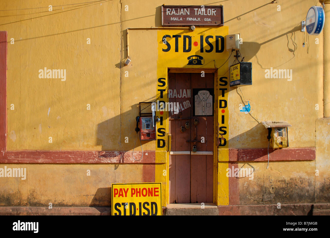 Tailor shop in Panjim, Goa, advertising telephone services Stock Photo ...