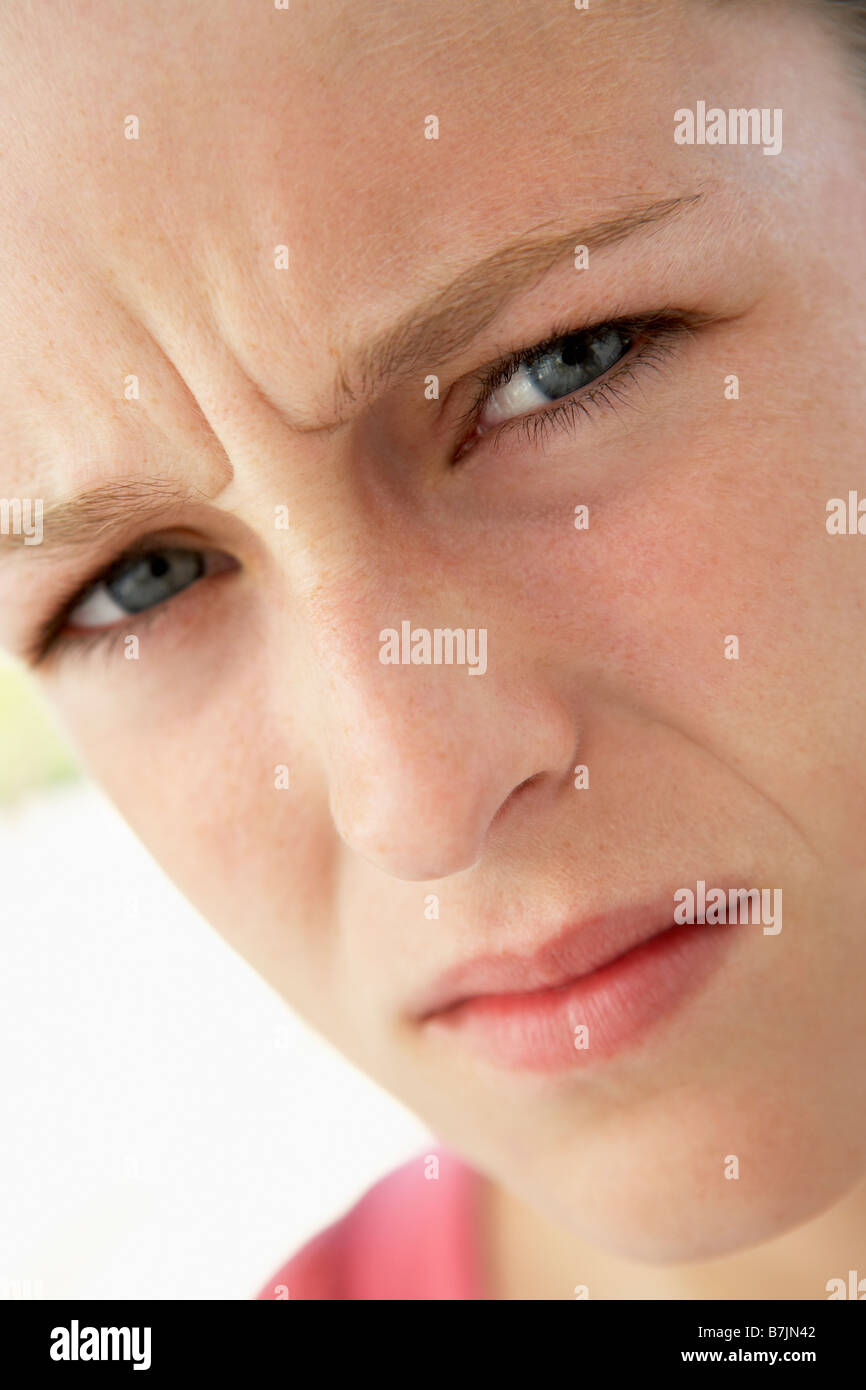 Portrait Of Teenage Girl Frowning Stock Photo - Alamy