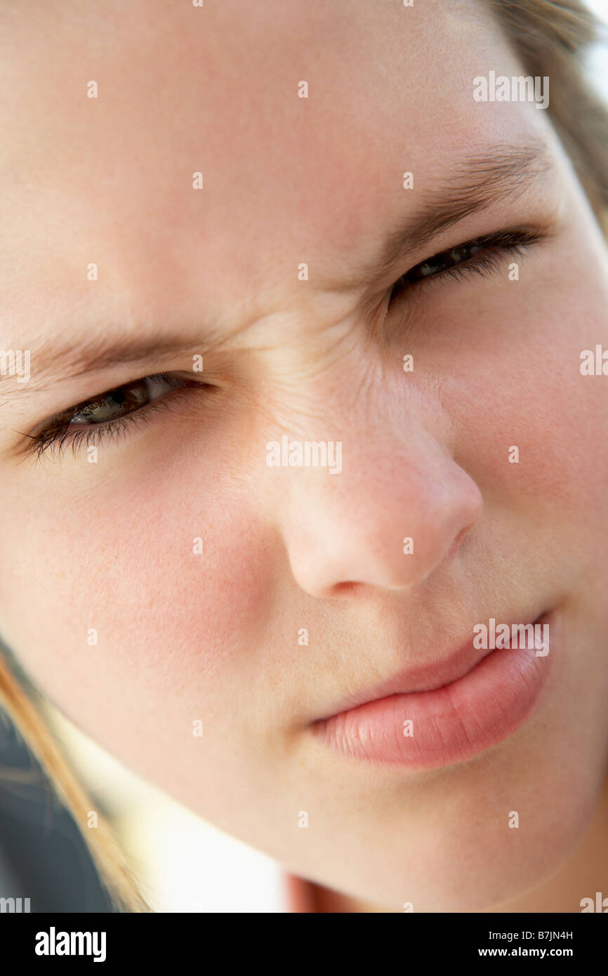 Portrait Of Teenage Girl Frowning Stock Photo - Alamy