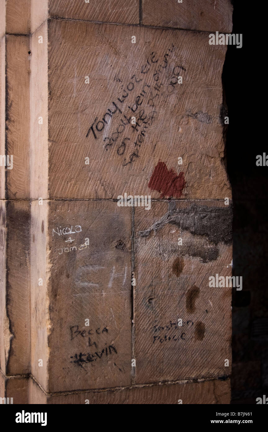 Graffiti scratched into stone Stock Photo - Alamy