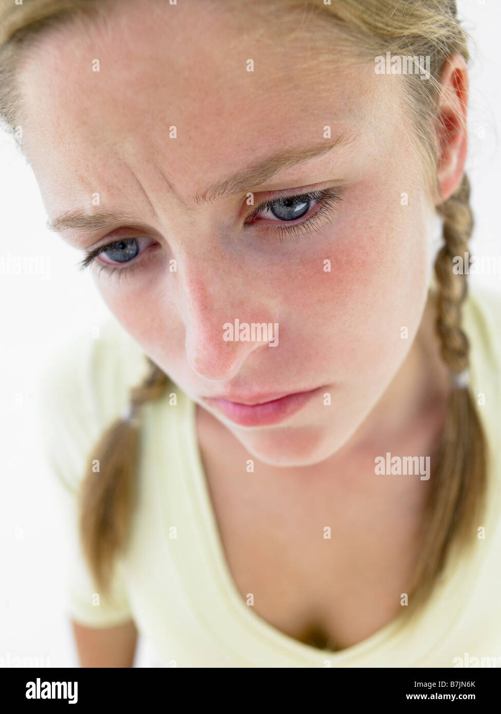 Portrait Of Teenage Girl Frowning Stock Photo - Alamy