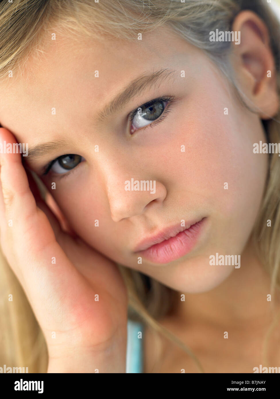 Portrait Of Girl Looking Sad Stock Photo - Alamy