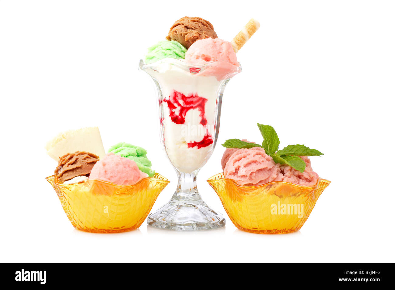 Three delicious multi flavor ice cream glasses reflected on white ...