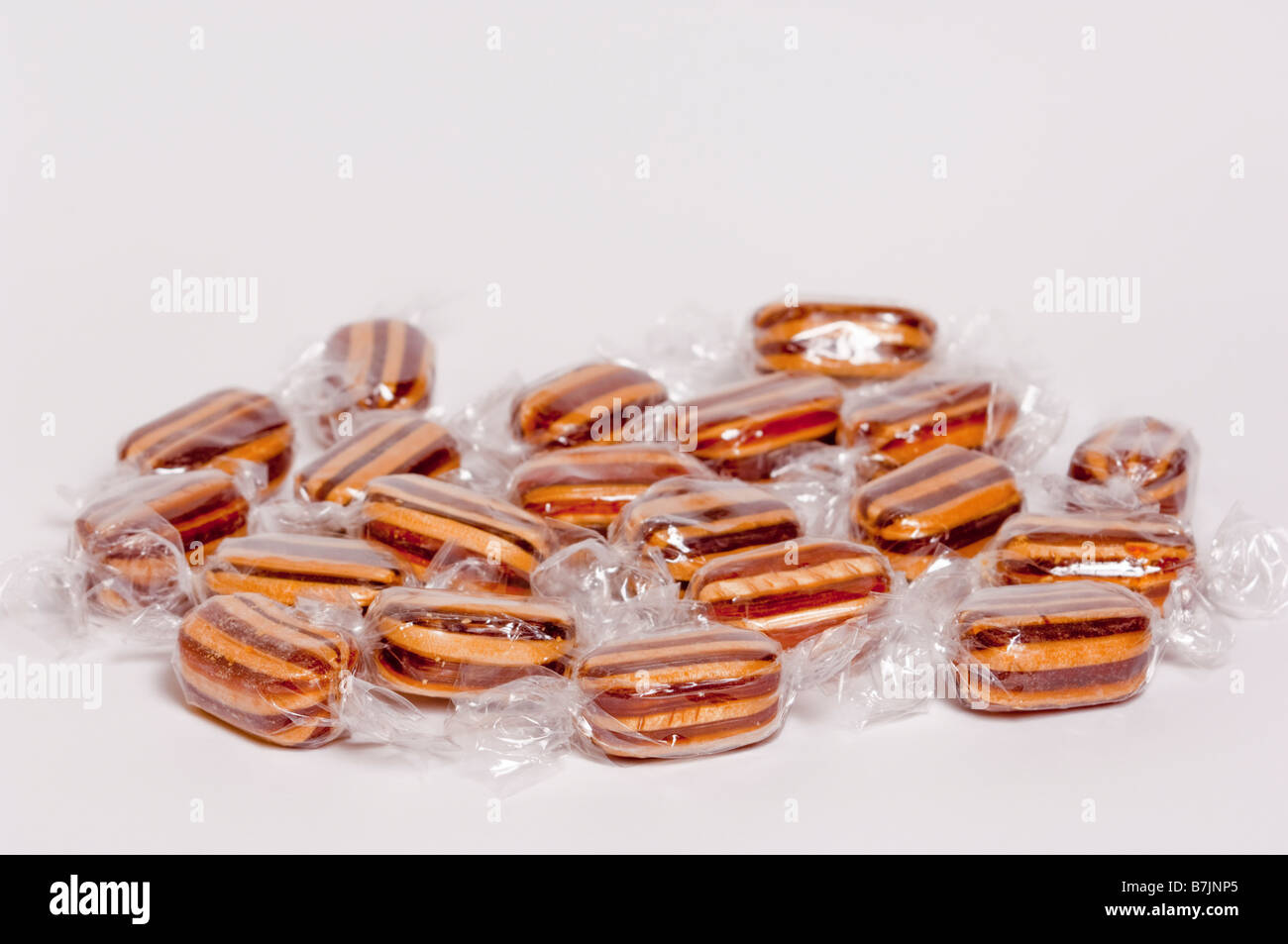 A few humbug boiled sweets shot on a white background Stock Photo - Alamy