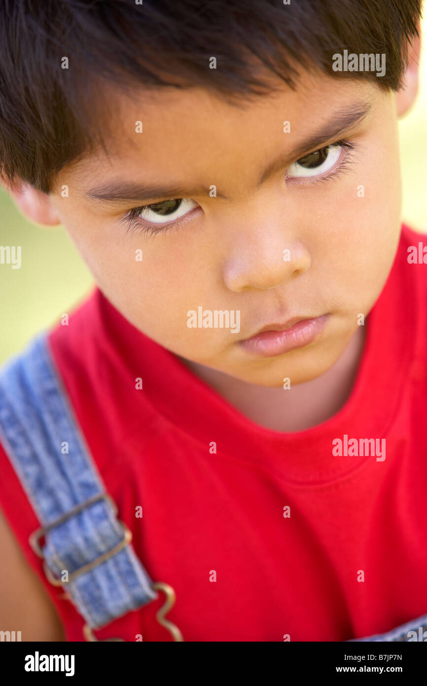 Portrait Of Young Boy Sulking Stock Photo - Alamy