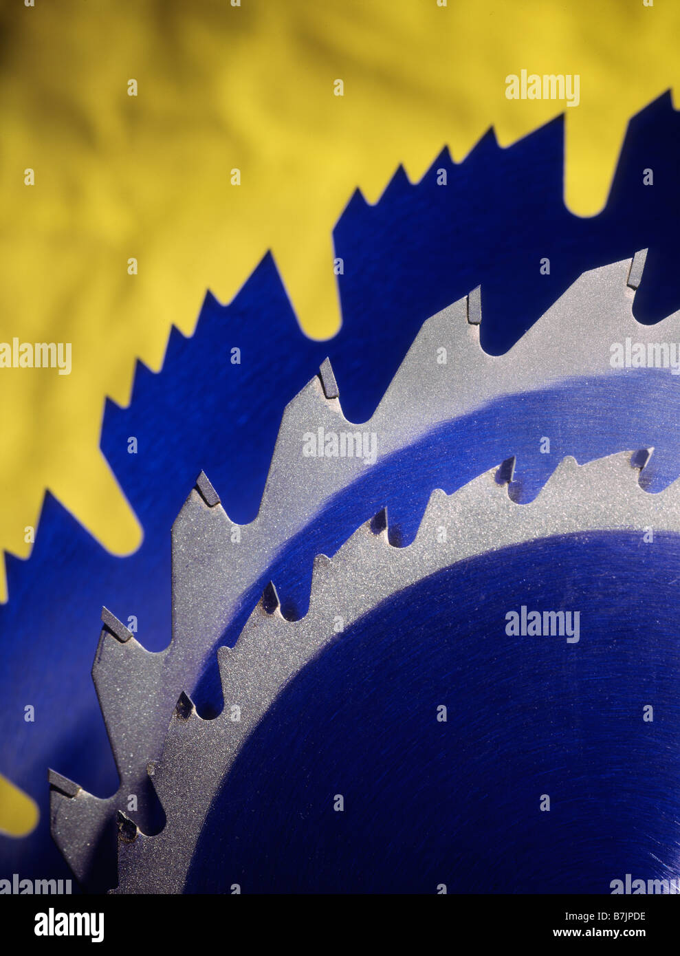 sections of circular saw blades in profile with blue reflection on ...