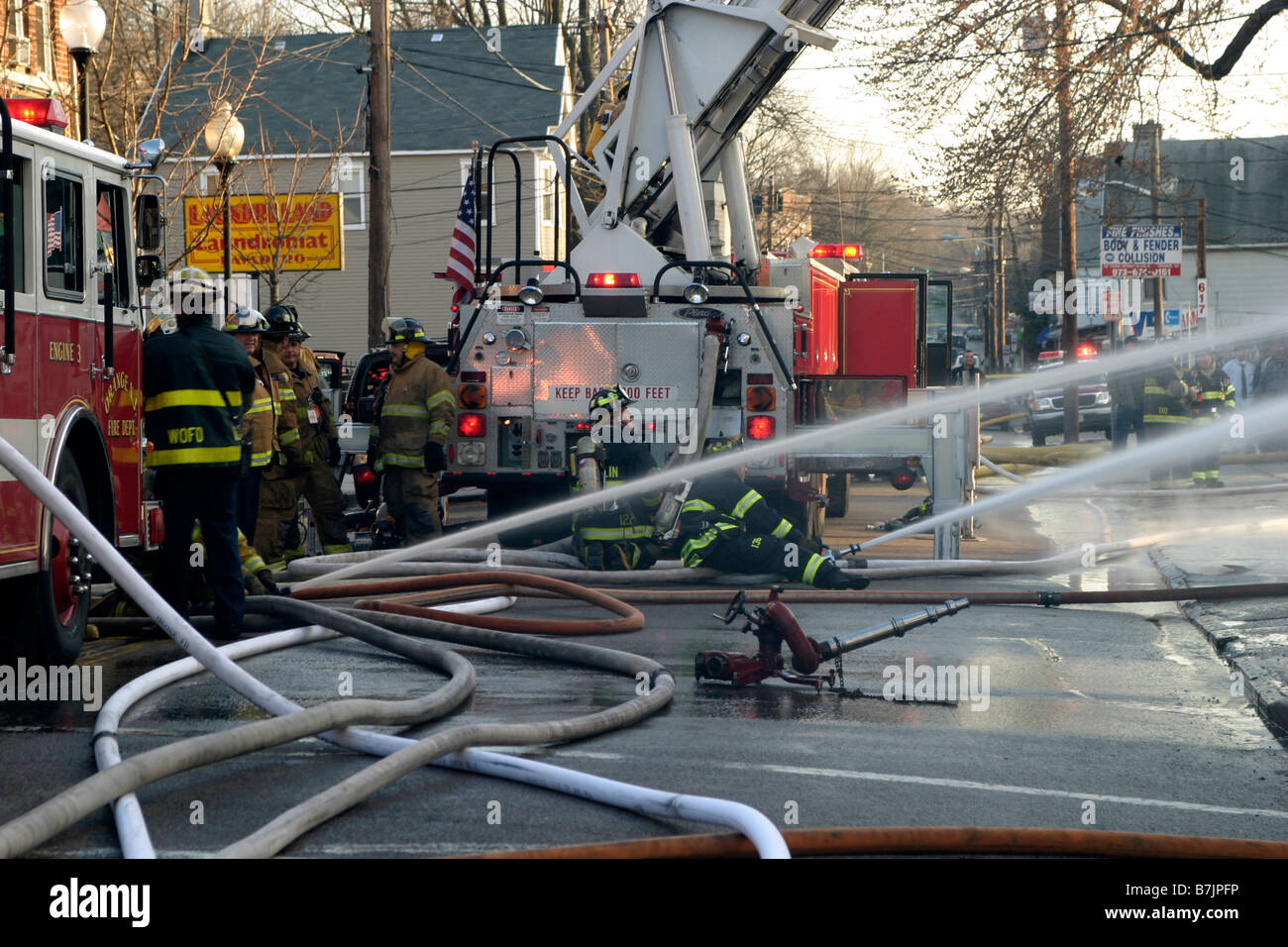 Fire fighters tackling a building fire Stock Photo - Alamy