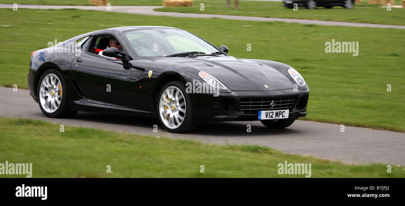 Ferrari F599 in black on track Stock Photo - Alamy