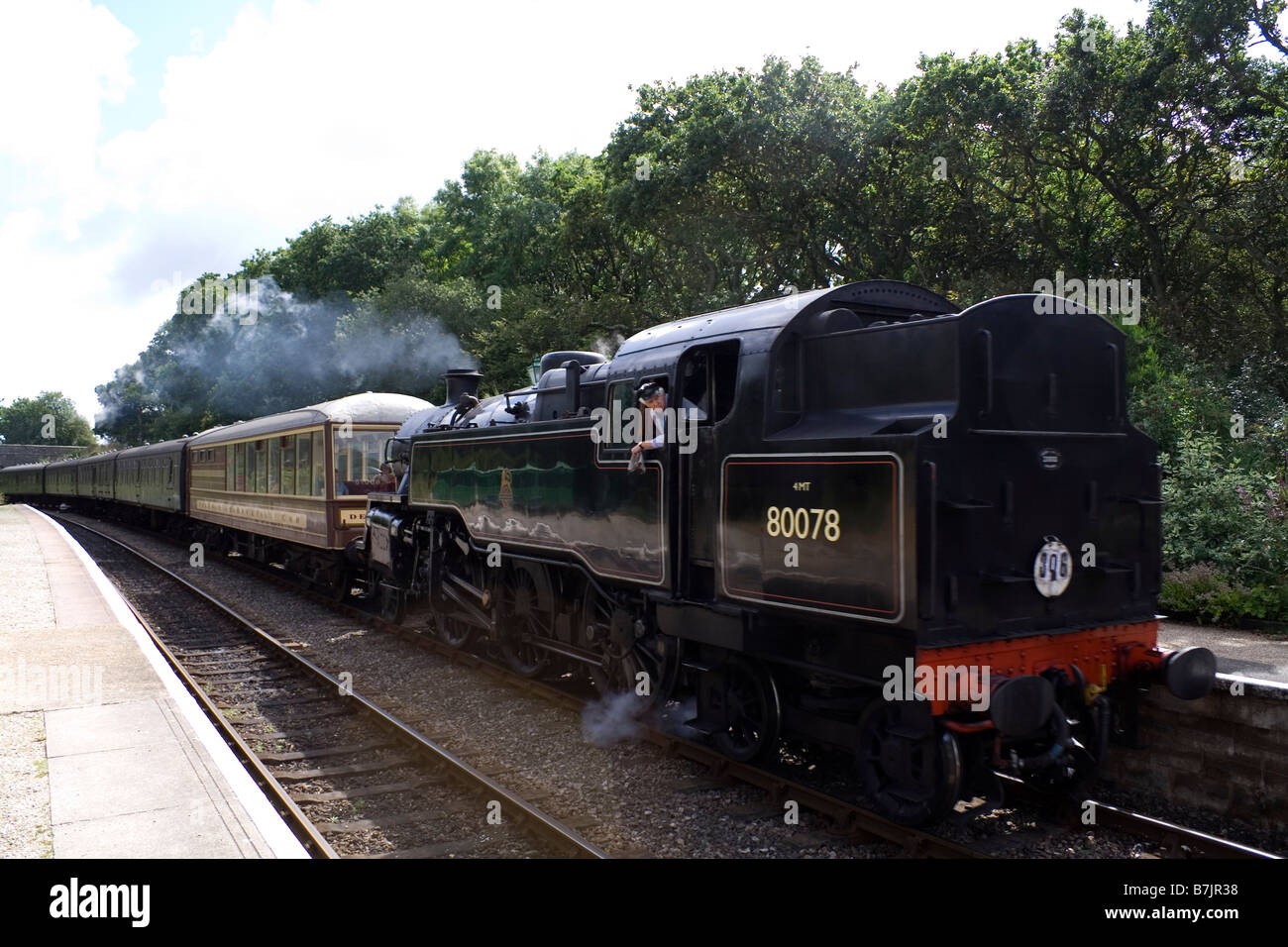 A steam locomotive pulls into Harmans Cross Station on the Isle of ...