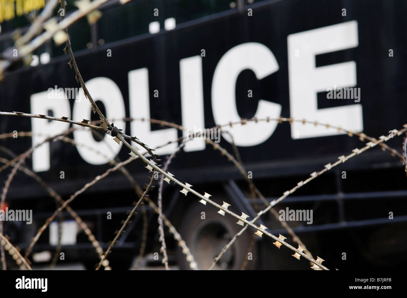 Razor wire barricades erected by the police to control block the street ...
