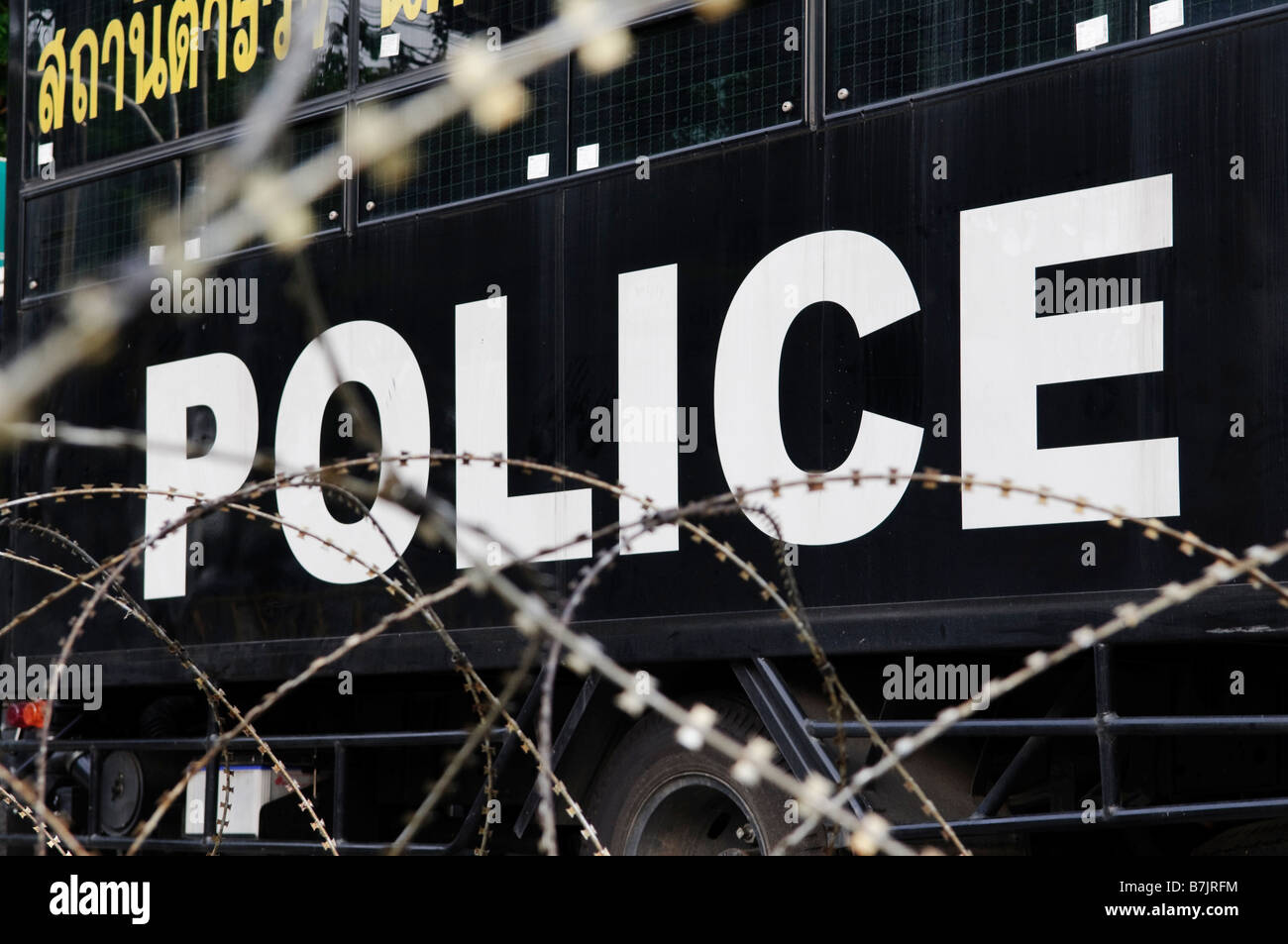 Razor wire barricades erected by the police to control block the street ...