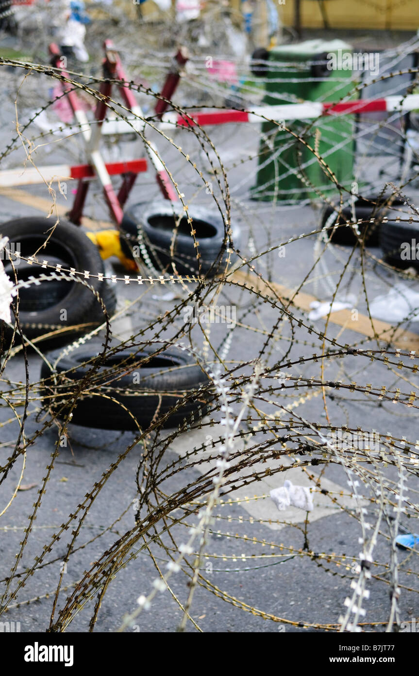 Razor wire barricades erected by the police to control block the street ...