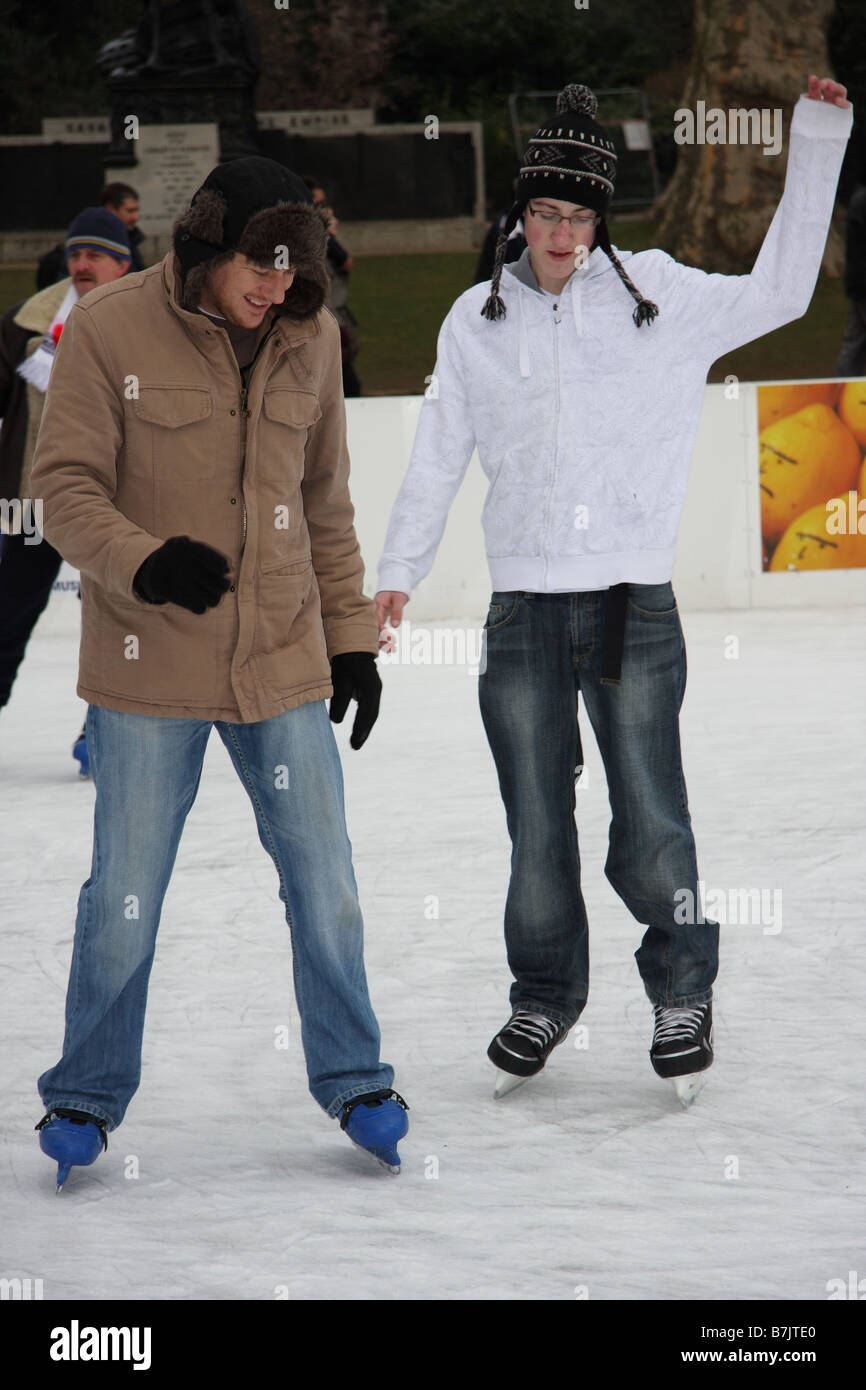 male teenagers girl ice skating skaters rink fun jewish open air cold ...