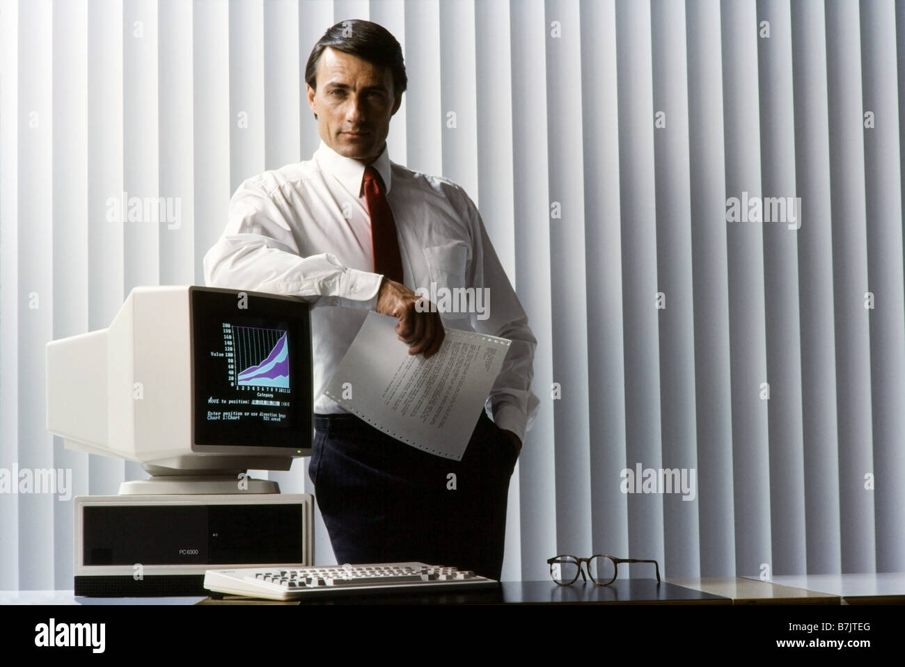 Executives at work in office setting with computer Stock Photo - Alamy
