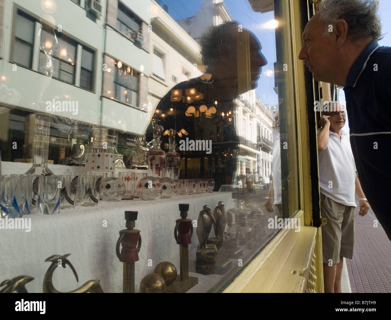 Buenos Aires Argentina Antique shop windows reflect antique shoppers ...