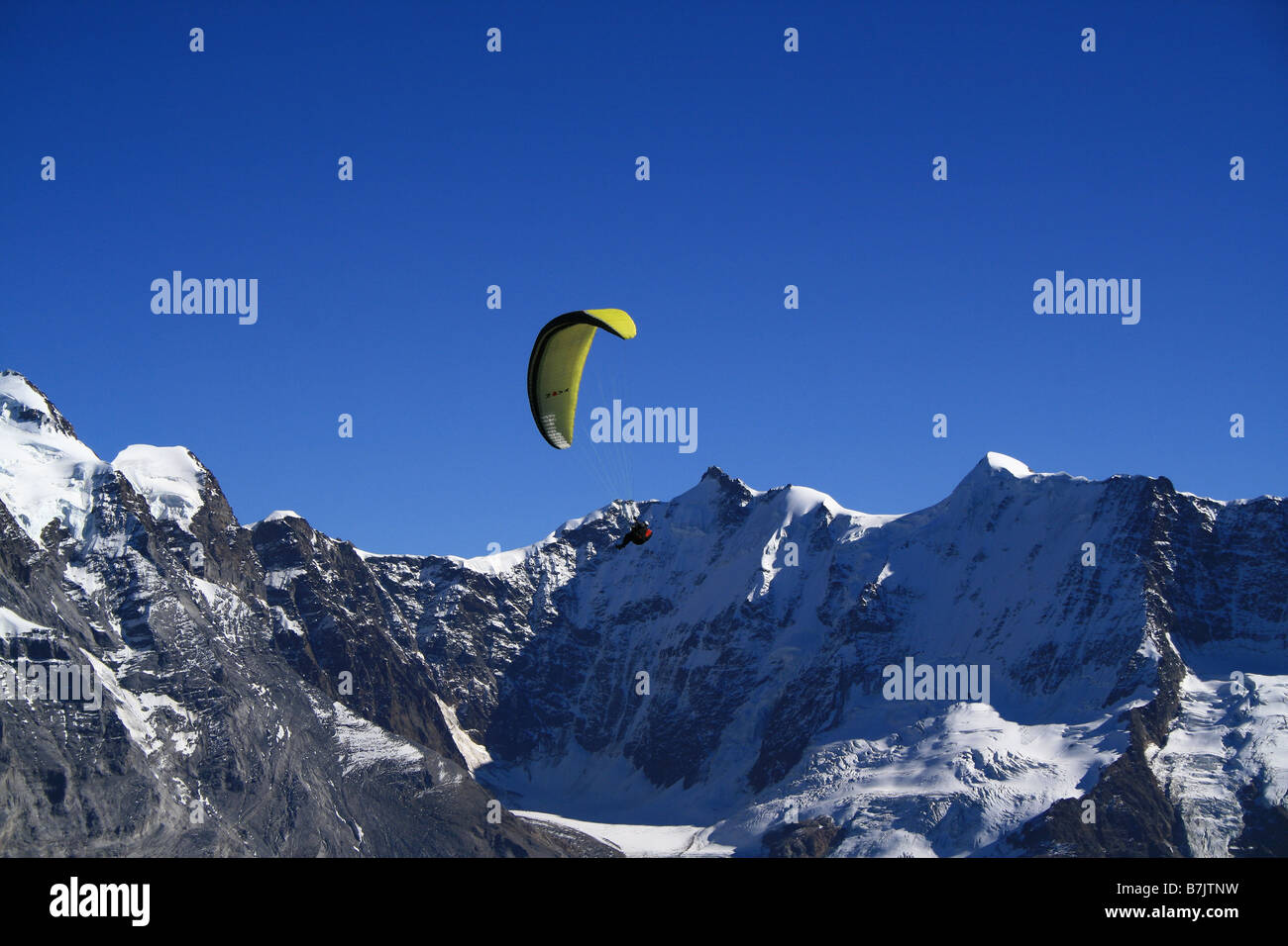 Hang Glider above the Swiss alps Stock Photo - Alamy