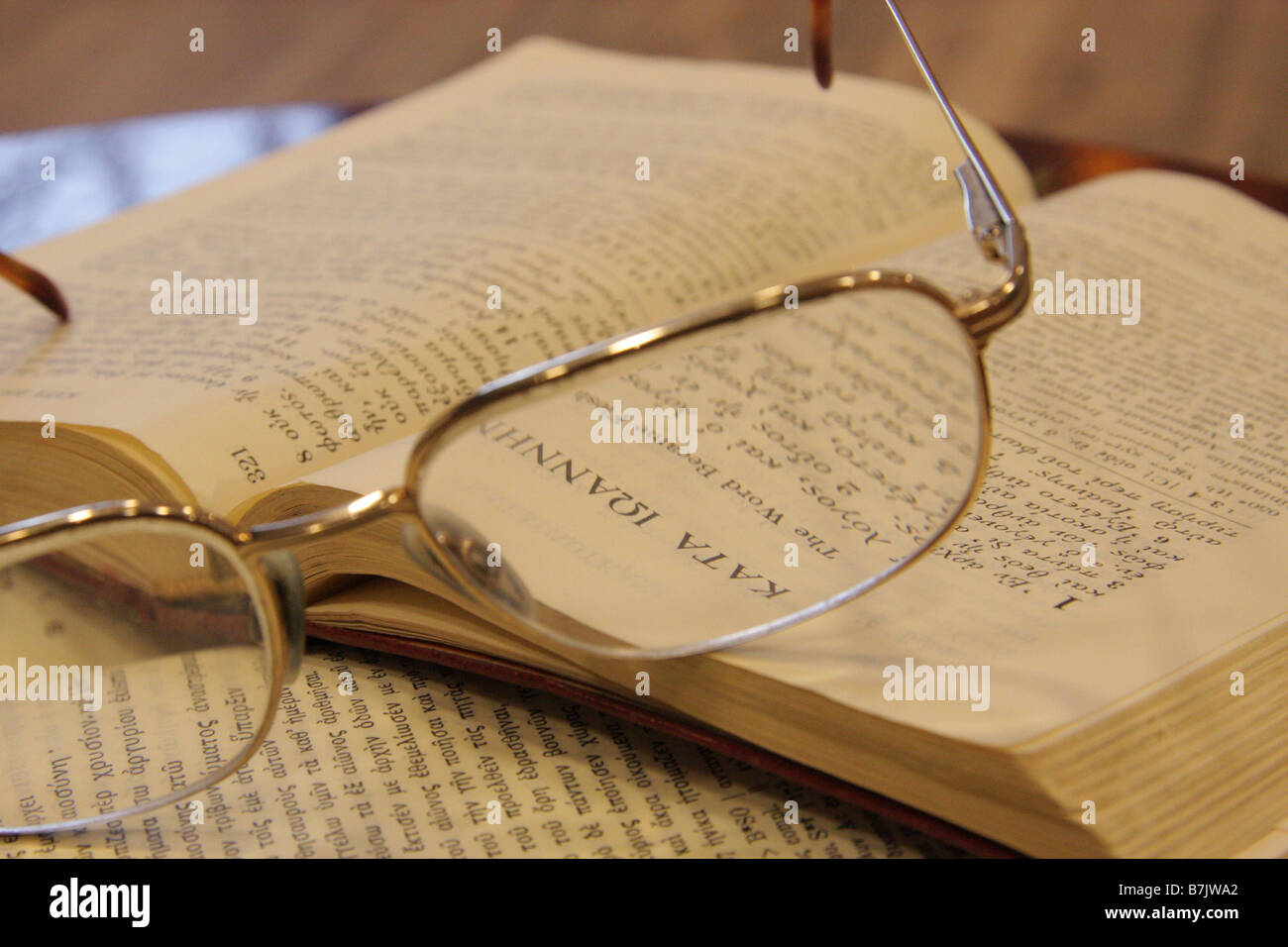 Reading glasses on a book Stock Photo - Alamy