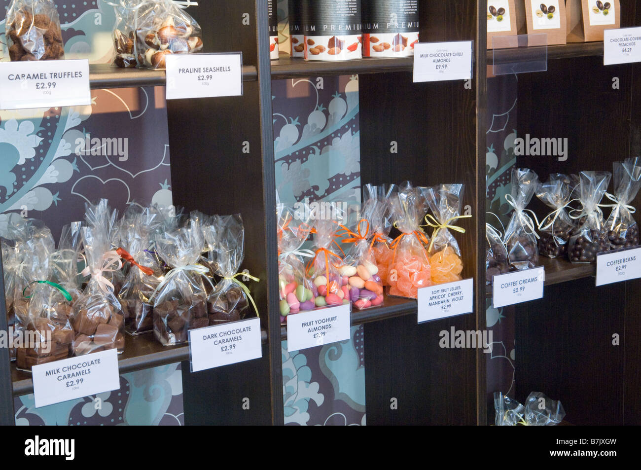 Rows of sweet candy for sale in bags. Bags of candies Stock Photo - Alamy