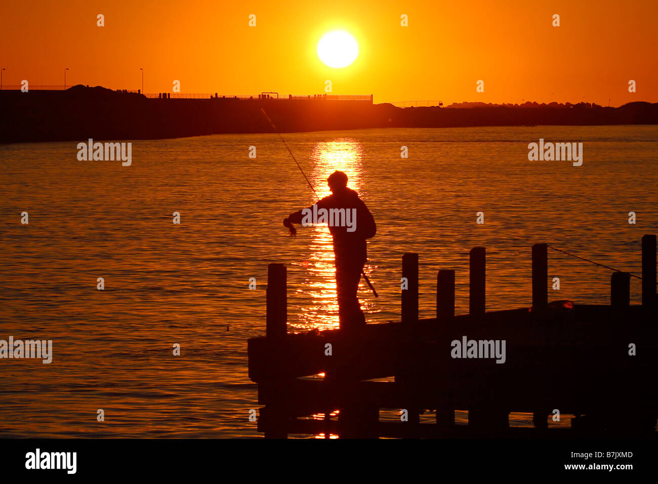 Fishing at Sunset Stock Photo - Alamy