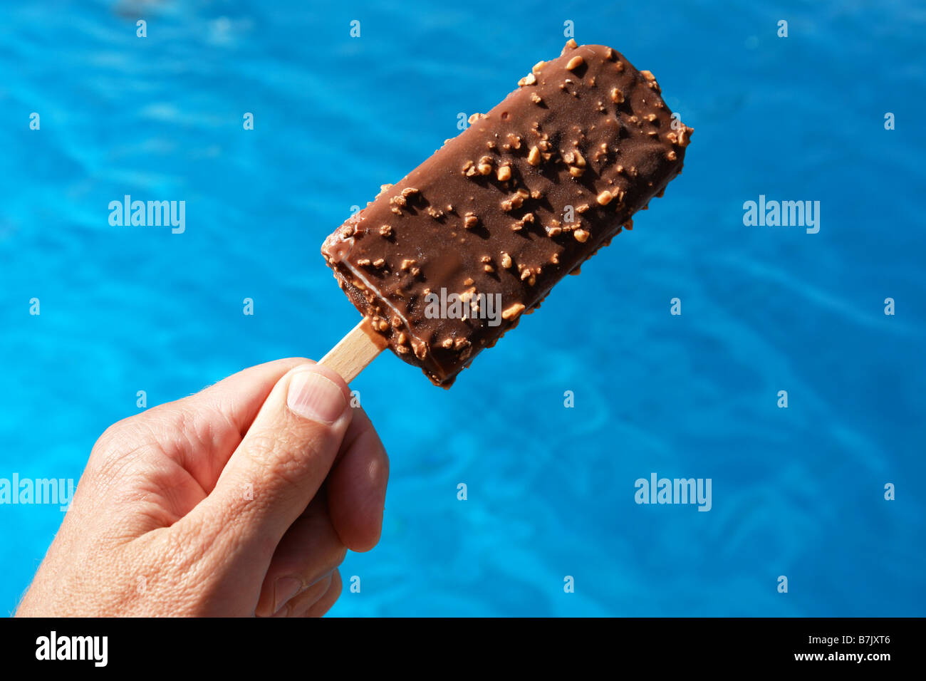 popsicle against a swimming pool Stock Photo - Alamy