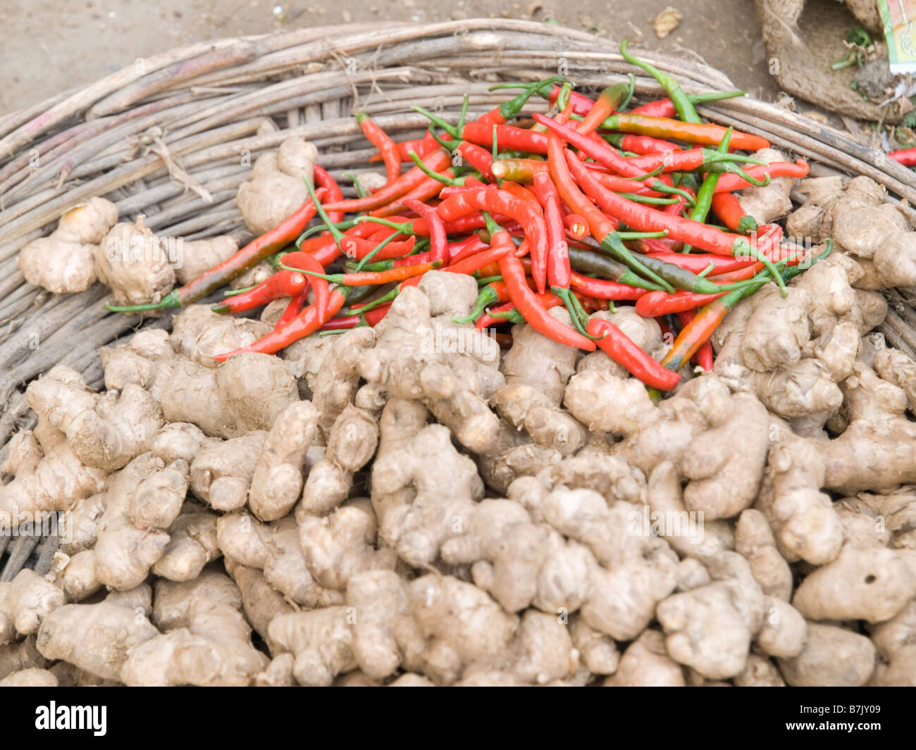 A seller of vegetables in a market Stock Photo - Alamy