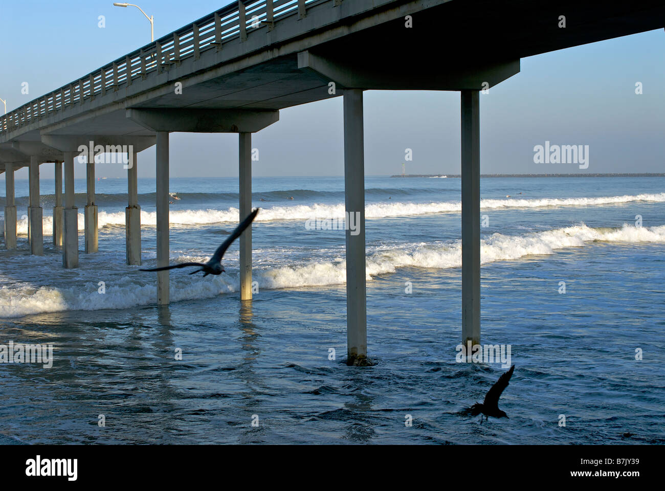 waves breaking under Ocean Beach pier Stock Photo - Alamy