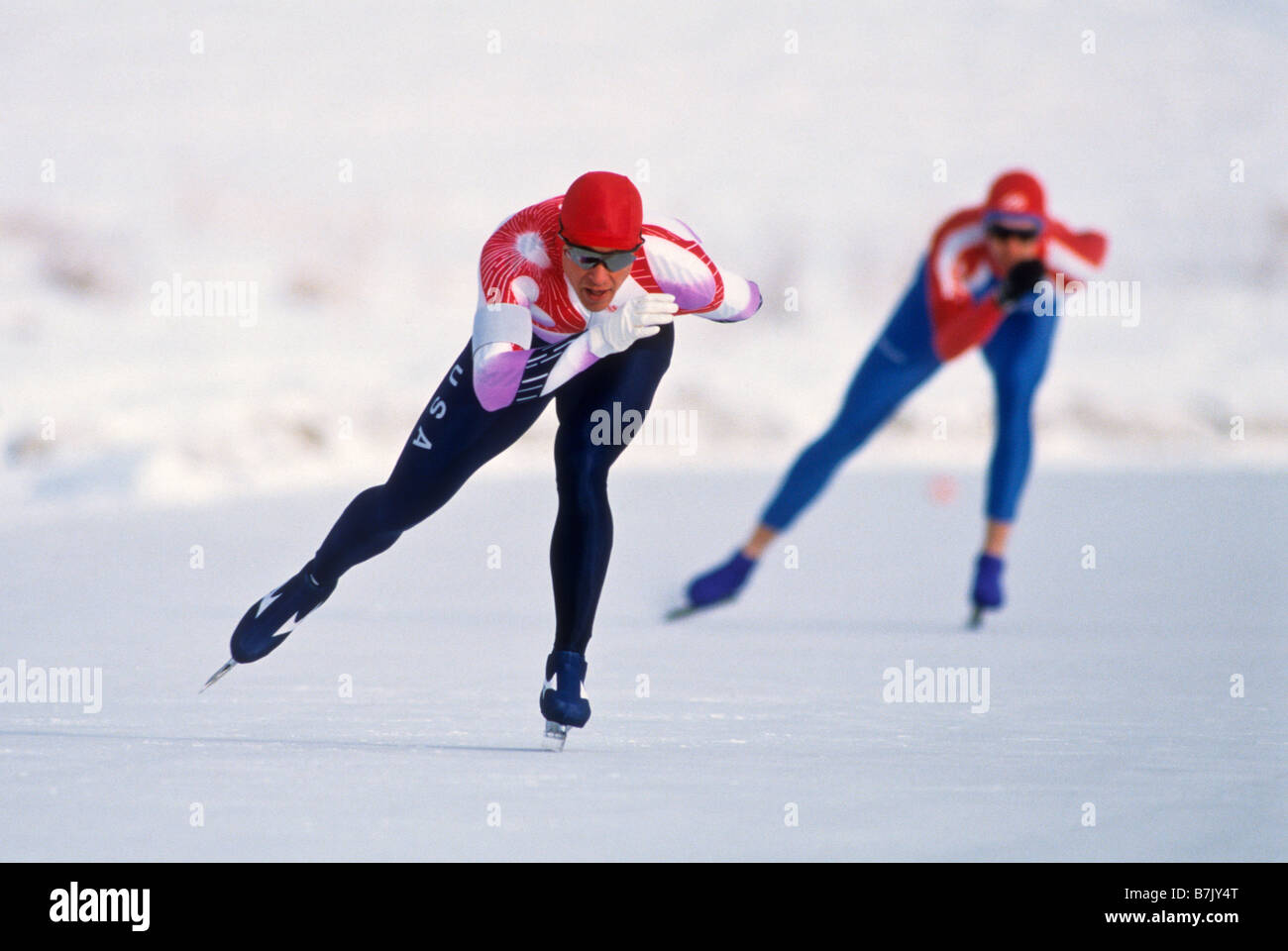 Male speed skaters in action Stock Photo - Alamy