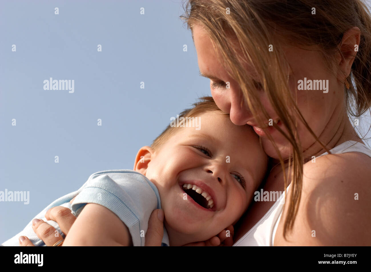 Young mother and son having fun together Stock Photo - Alamy