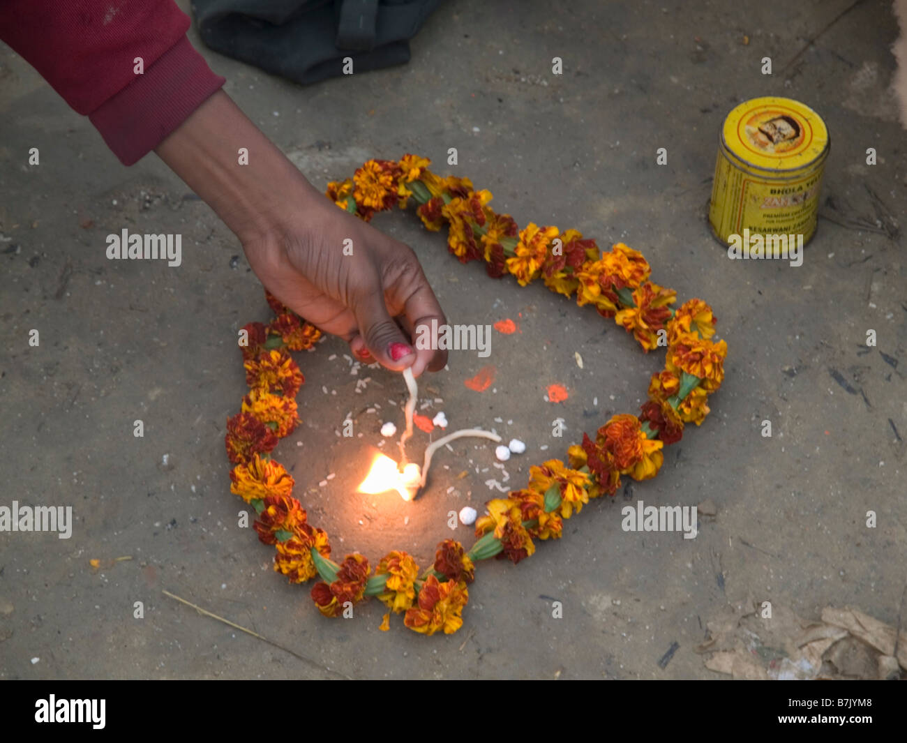 Pilgrims performs a Hindu ritual at dawn on the bank of the holy river ...