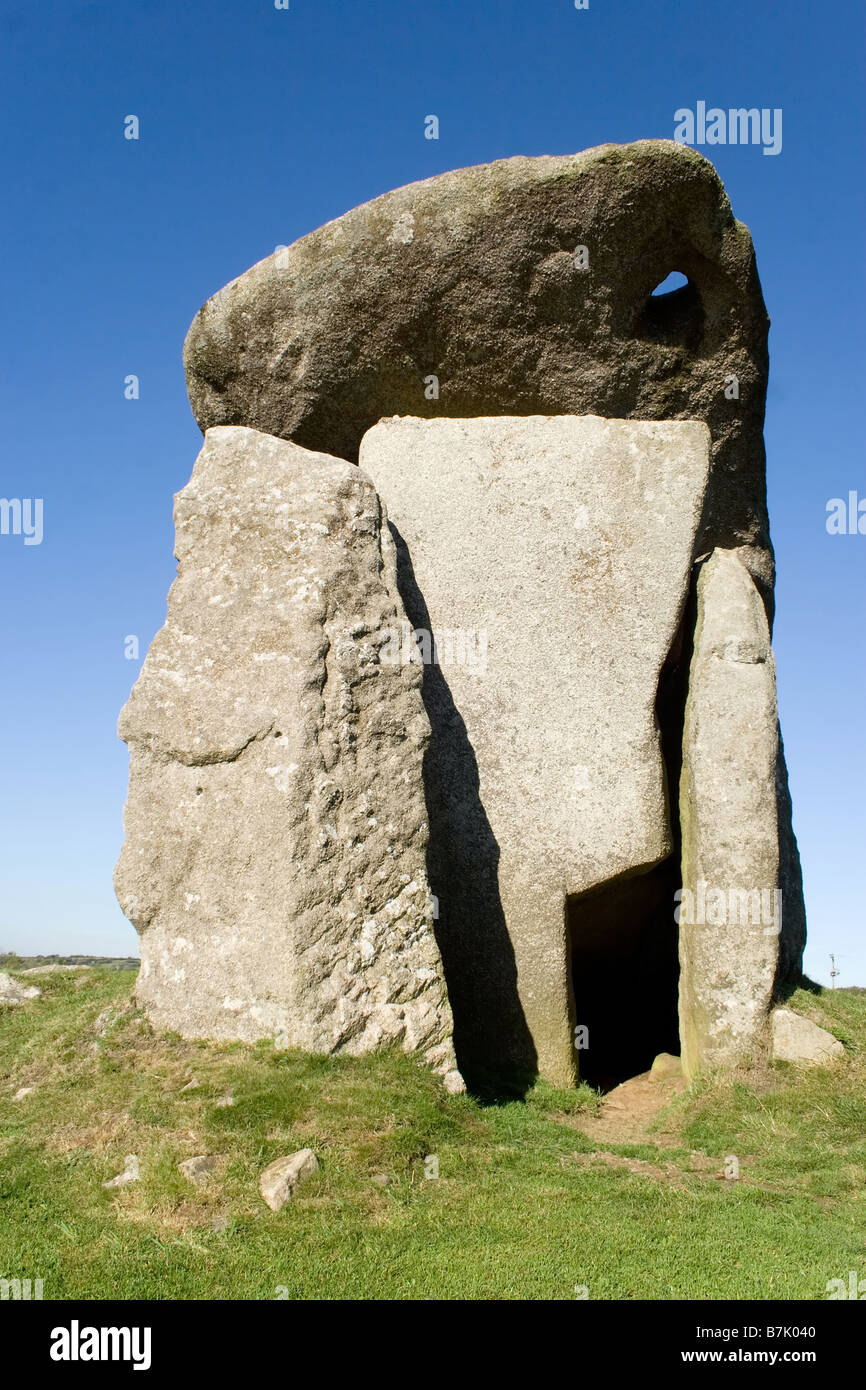ancient stone monument in grass field with blue sky Stock Photo - Alamy