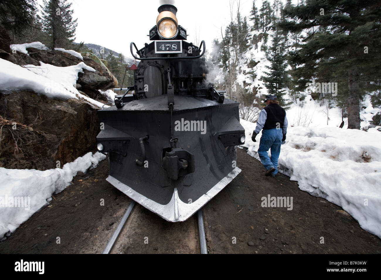 Engineer maintains a steam powered locomotive on the Durango Silverton ...