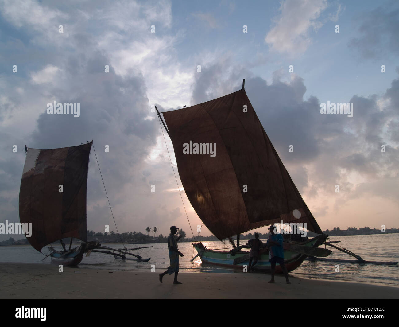 Sail powered fishing boats on beach Stock Photo - Alamy