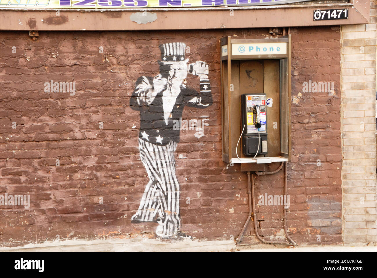 Uncle Sam painted on red brick wall by pay phone Stock Photo - Alamy
