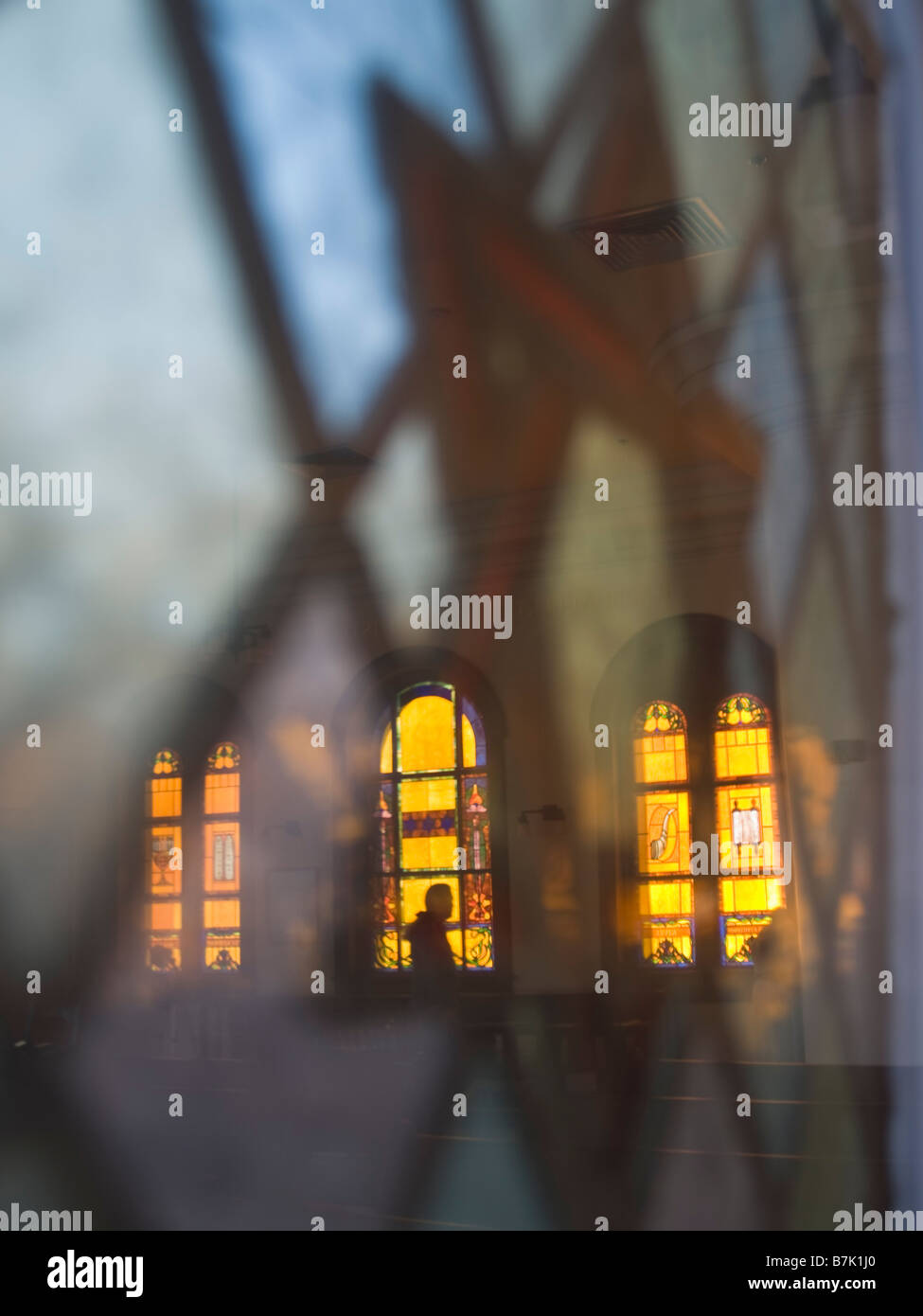 Reflection in a historical window in in the museum section of a ...