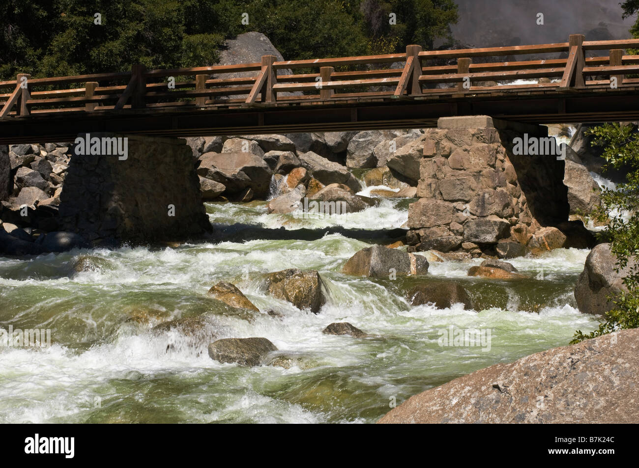 bridge over whitewater river at the base of yosemite falls, yosemite ...