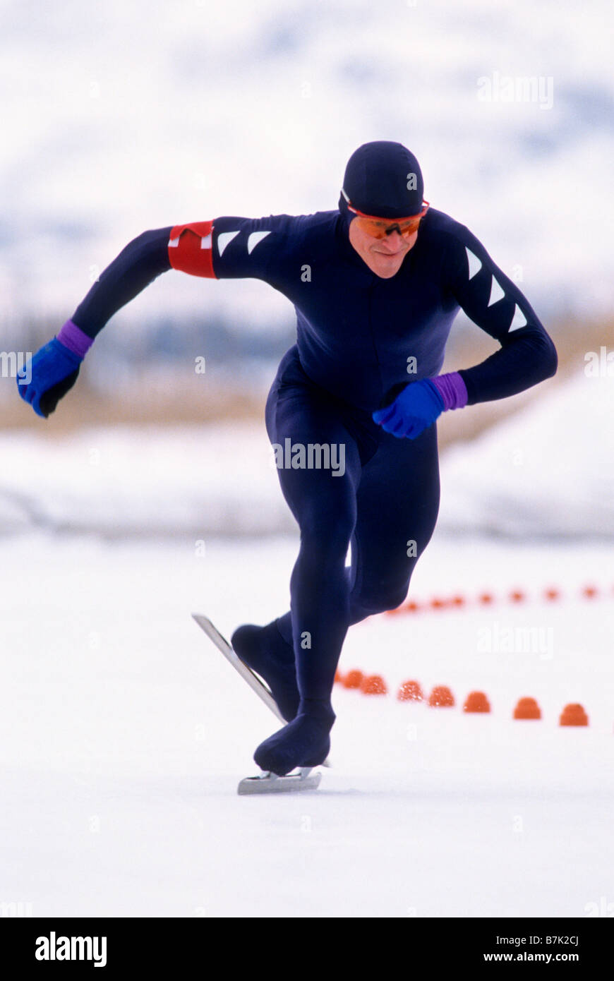 Male speed skater in action at the start Stock Photo - Alamy